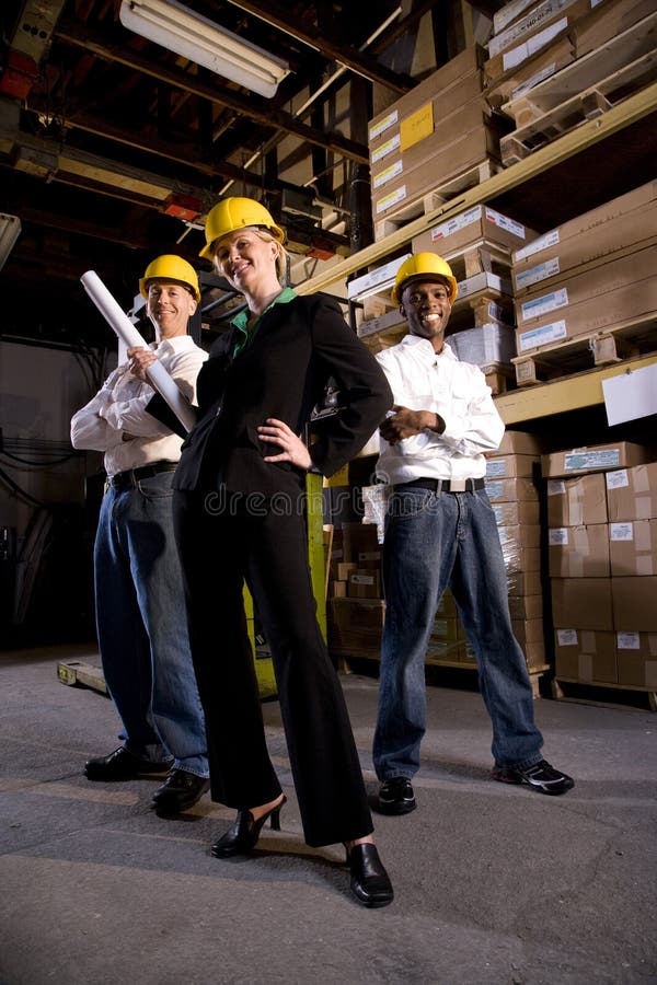 Factory Workers Checking Goods on Production Line Stock Image - Image ...