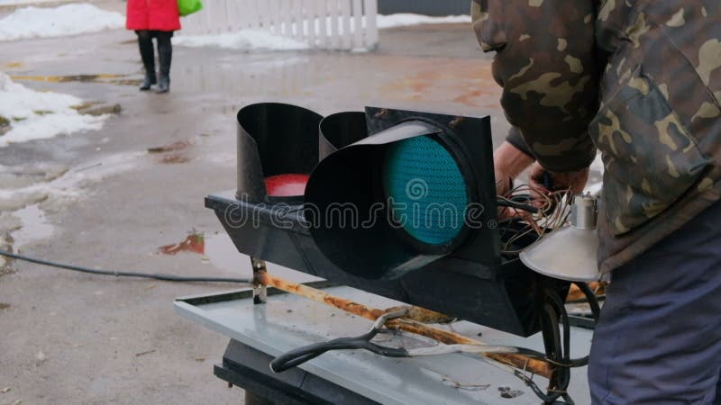 Workers Fix the Lights of a Broken Traffic Light Stock Footage - Video ...