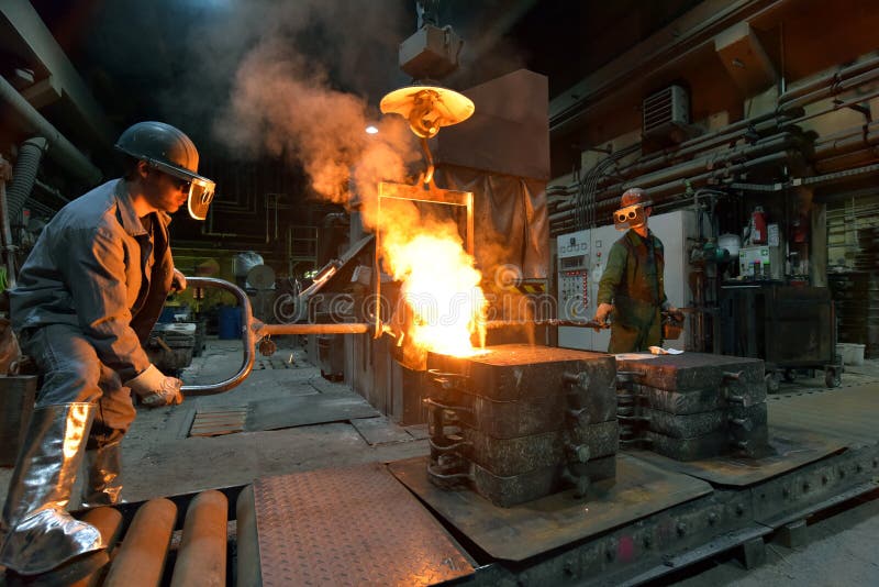 Workers in a Foundry Casting a Metal Workpiece - Safety at Work and ...