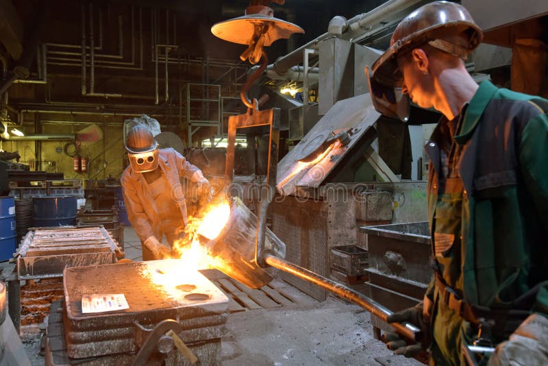 Workers in a Foundry Casting a Metal Workpiece - Safety at Work and ...