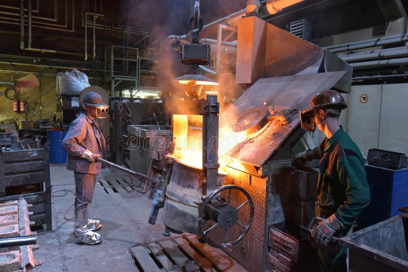 Workers in a Foundry Casting a Metal Workpiece - Safety at Work and ...