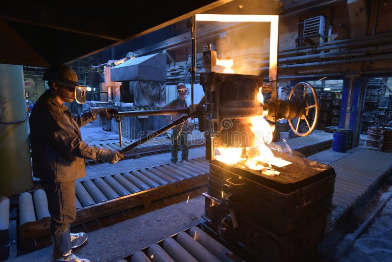 Workers in a Foundry Casting a Metal Workpiece - Safety at Work and ...