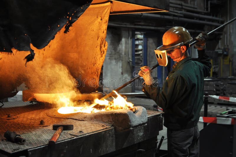 Workers in a Foundry Casting a Metal Workpiece - Safety at Work and ...
