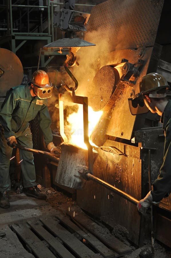 Workers in a Foundry Casting a Metal Workpiece - Safety at Work and ...