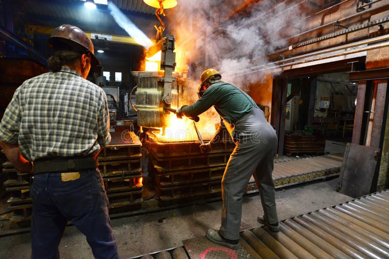 Workers In A Foundry Casting A Metal Workpiece - Safety At Work And ...