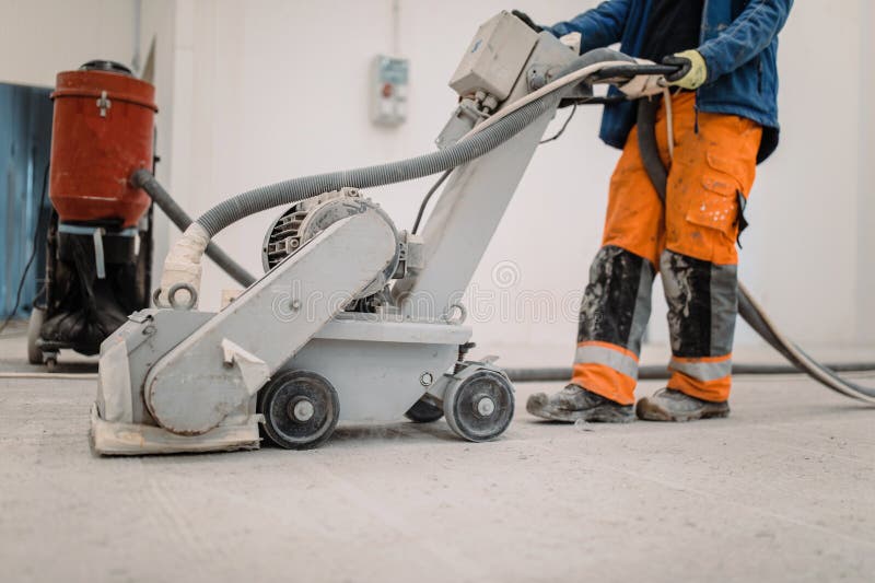 Workers Grind the Concrete Floor at the Construction Site Stock Image ...