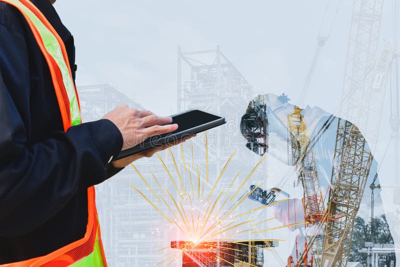 Workers with Hand Holding Tablet in Construction Site with and Double ...