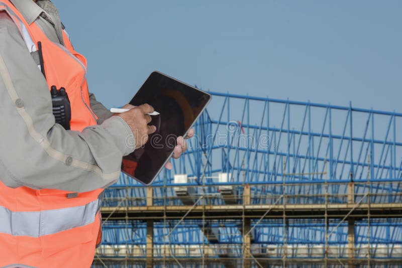 491 Smiling Construction Worker Using Tablet Stock Photos - Free ...