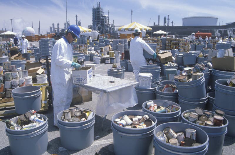 Workers Pouring Toxic Wastes into a Metal Drum Stock Photo - Image of ...