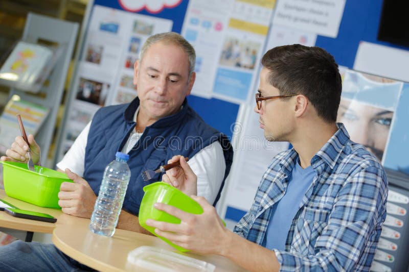 2 Workers Having Lunch Together Stock Photo - Image of mature ...