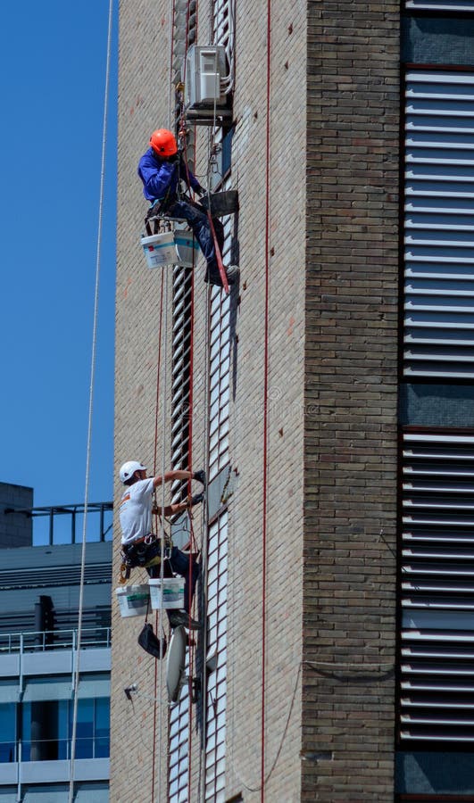 Workers at Height Making Repairs on the Facade Editorial Image - Image ...