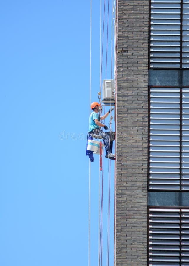 Workers at Height Making Repairs on the Facade Editorial Stock Image ...