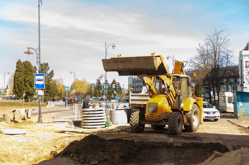 Workers with the Help of Earthmoving Equipment are Reconstructing ...