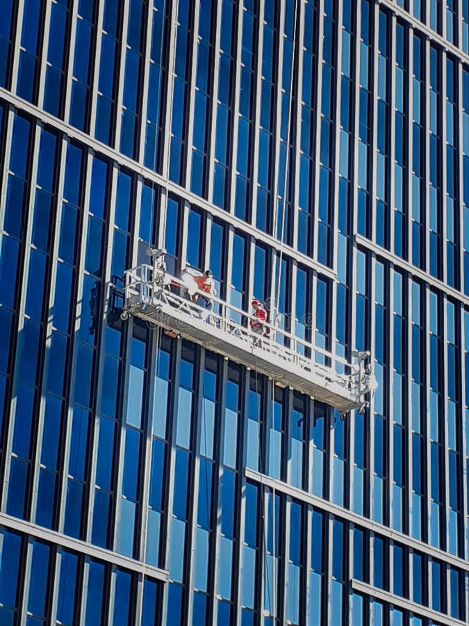 Workers in a High Rise Window Cleaning Platform. Editorial Stock Photo ...