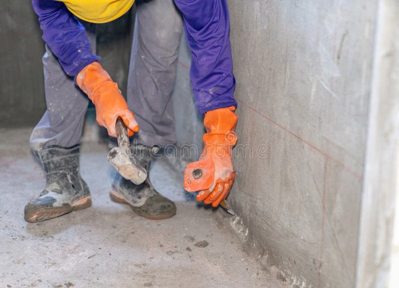 Workers Hitting Hammer on Chisel for Concrete Chipping Stock Photo ...