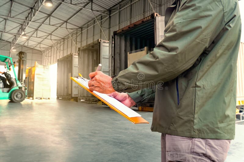 Workers Hold Clipboards and Check Forklift Loading of Goods into ...