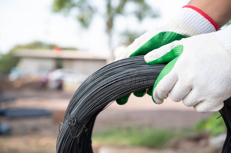 Workers hold steel wire stock image. Image of contractor - 151278359