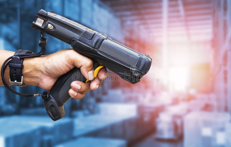 Workers Holding Bar Code Scanner on Blurred Storage Warehouse. Computer ...