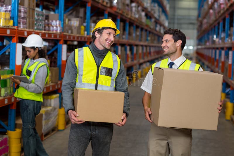 Workers Holding Box Looking Each Other Stock Image - Image of caucasian ...