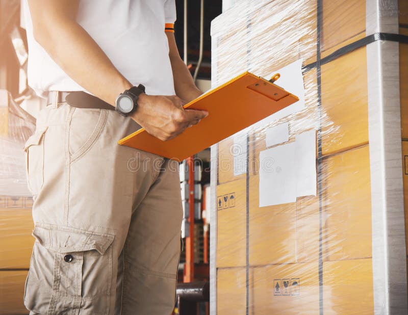 Workers Holding Clipboard is Checking Packaging Boxes on Conveyor Belt ...