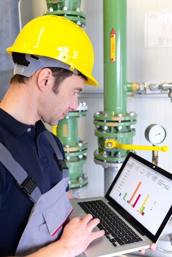 Workers in an Industrial Plant Check the Systems with Modern Technology ...