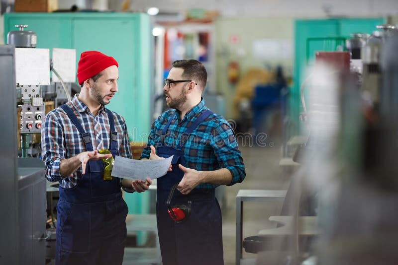729 Two Workers Talking Factory Stock Photos - Free & Royalty-Free ...