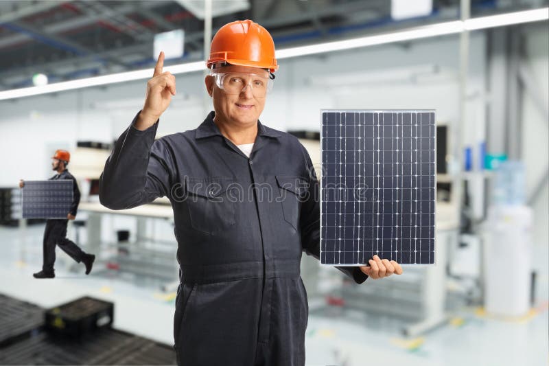 Workers Inside a Factory Holding a Solar Panel Stock Photo - Image of ...