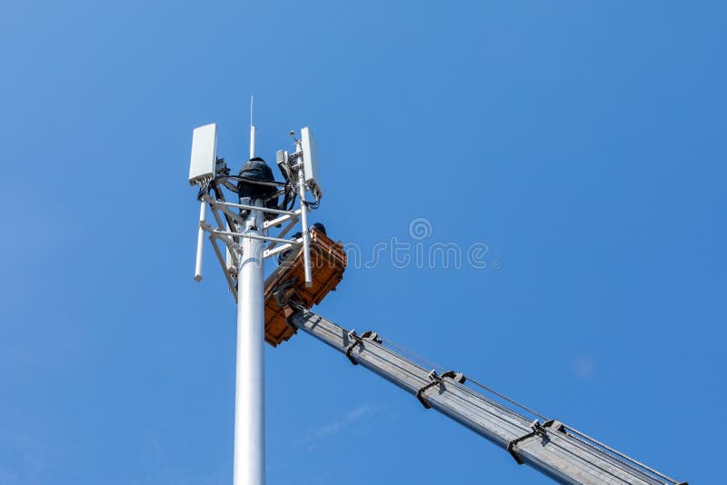 Workers Install Cellular Base Station with Transmitters 3G, 4G, 5G and ...