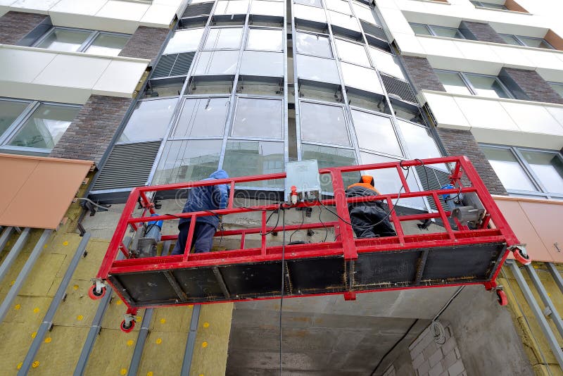 Workers Install Glass and Panels on the Facade of Building Stock Image ...
