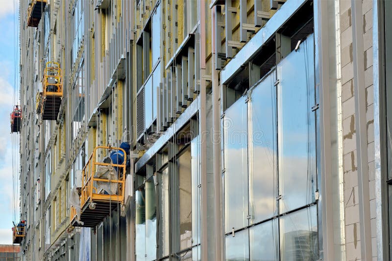 Workers Install Glass and Panels on the Facade of Building Stock Image ...