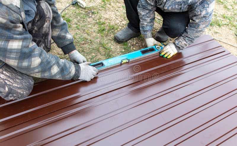 Workers Install a Metal Profile Fence Stock Image - Image of installing ...