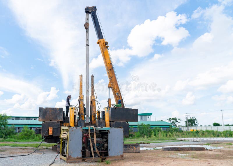 Workers Install Pile Driving by Hydraulic Static Pile Driver Machine ...