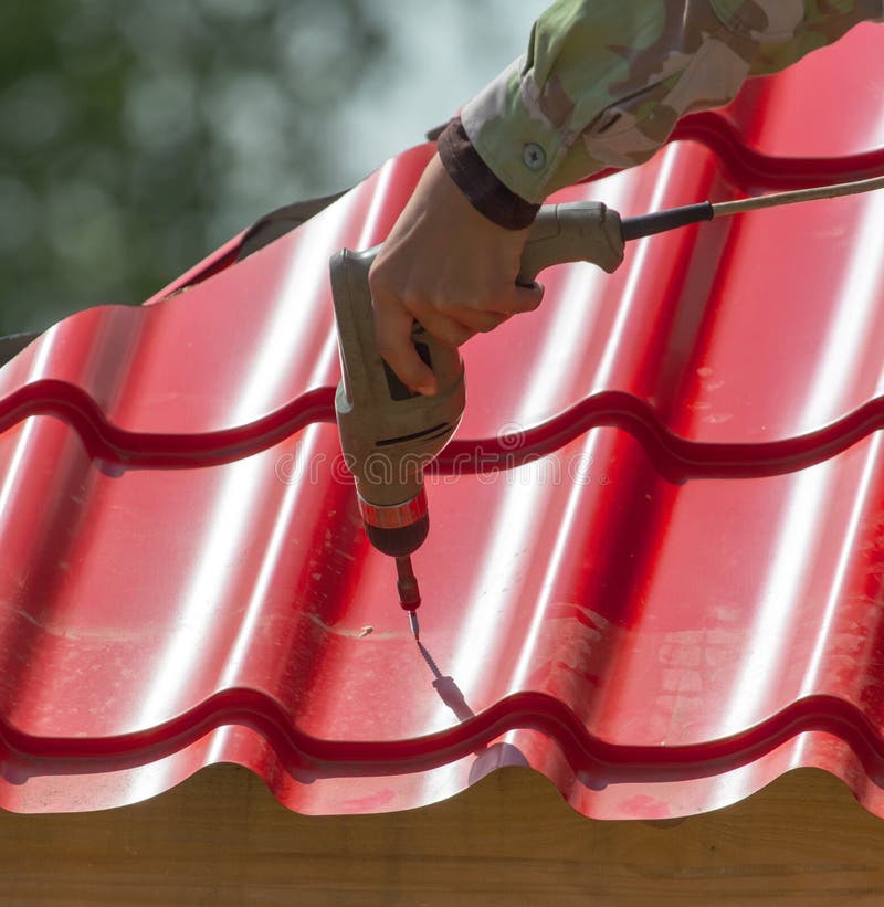 Workers Install Red Metal Tiles on the Roof Stock Image - Image of ...