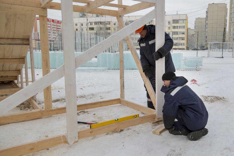 Workers on the Installation of the Frame of a Wooden Slide Stock Photo ...