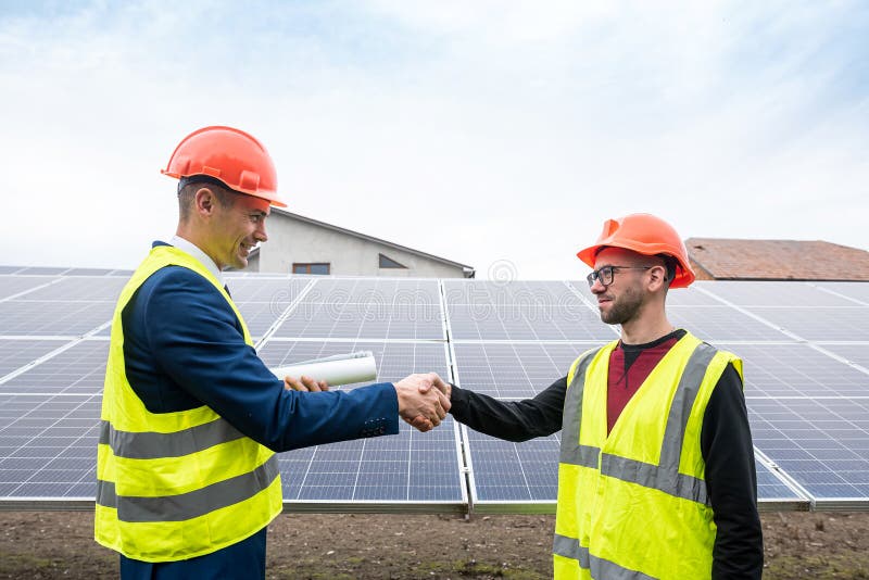 Workers on Installation of Solar Economical Panels Shake Hands after ...