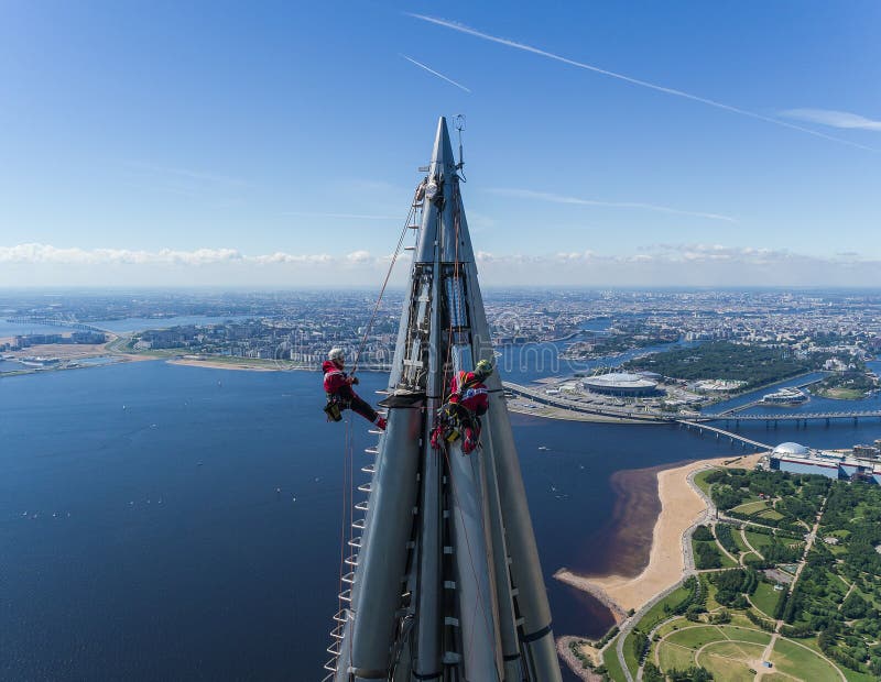Workers Installers at the Height Work at the Top of Skyscraper Stock ...