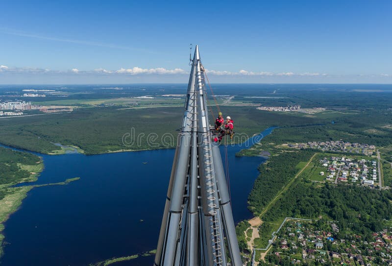 Workers Installers at the Height Work at the Top of Skyscraper Stock ...