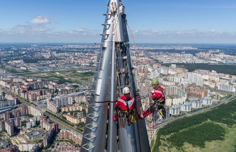 Workers Installers at the Height Work at the Top of Skyscraper Stock ...