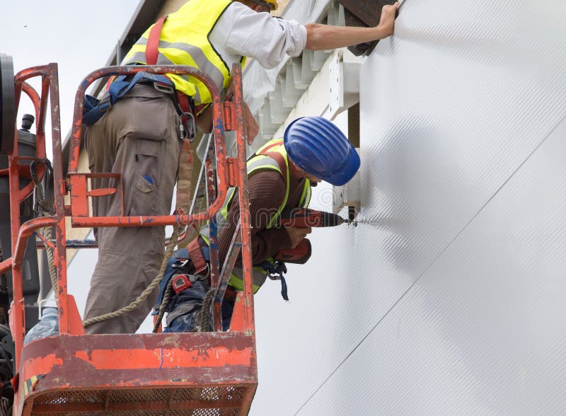 Workers Installing Facade Panels Stock Photos - Free & Royalty-Free ...