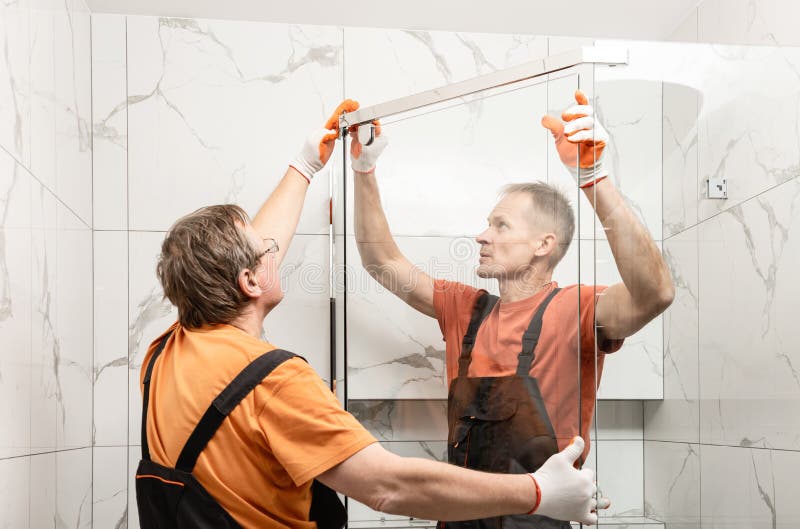 Workers are Installing Door of the Shower Enclosure Stock Photo - Image ...
