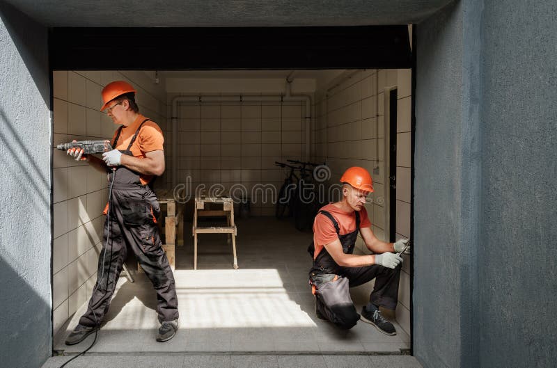 The Workers are Installing Lift Gate in the Garage Stock Image - Image ...