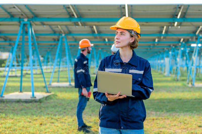 Workers Installing Solar Panels, Engineer Team at Solar Panel Farm ...
