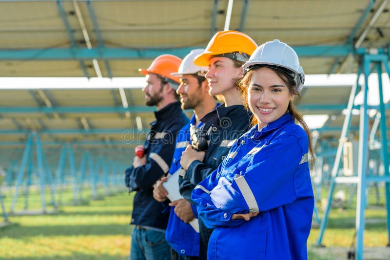 Workers Installing Solar Panels, Engineer Team at Solar Panel Farm ...