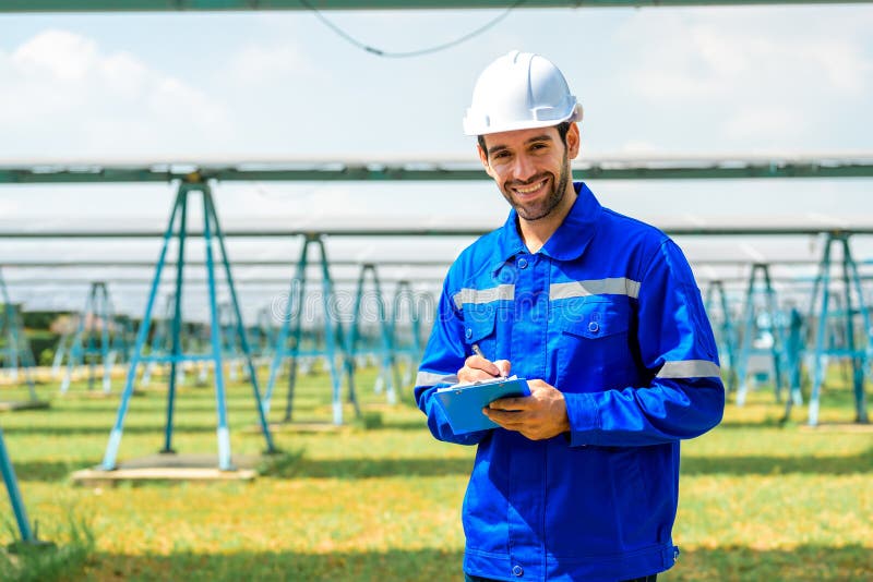 Workers Installing Solar Panels, Engineer Team at Solar Panel Farm ...