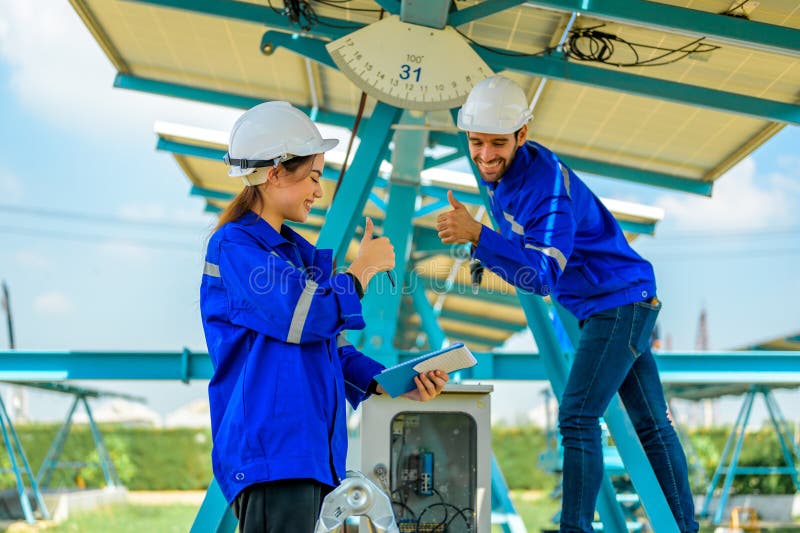 Workers Installing Solar Panels, Engineer Team at Solar Panel Farm ...