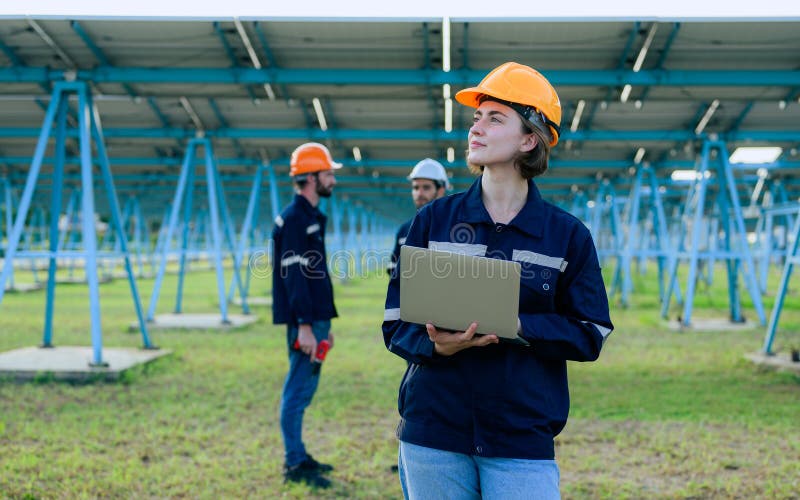 Workers Installing Solar Panels, Engineer Team at Solar Panel Farm ...