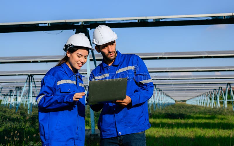 Workers Installing Solar Panels, Engineer Team at Solar Panel Farm ...