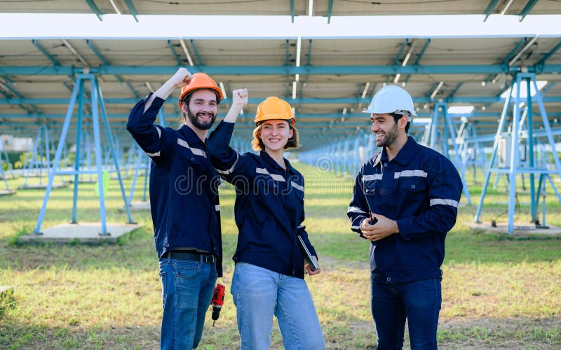 Workers Installing Solar Panels, Engineer Team at Solar Panel Farm ...