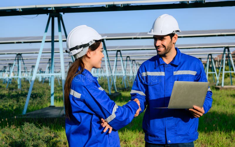 Workers Installing Solar Panels, Engineer Team at Solar Panel Farm ...