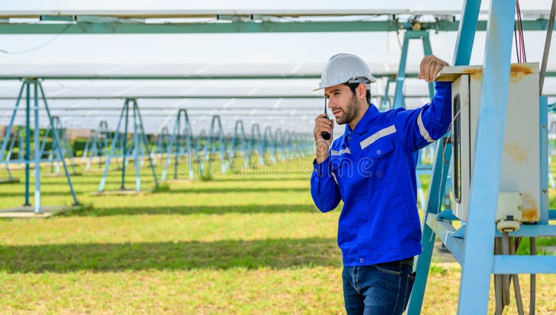 Workers Installing Solar Panels, Engineer Team at Solar Panel Farm ...